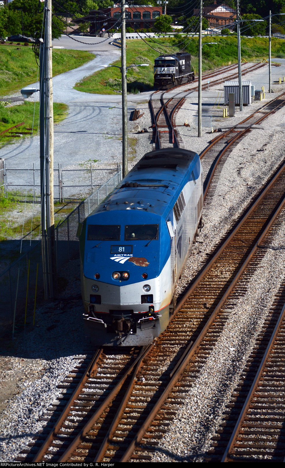 NS 6966 having been put away, AMTK 81 is eased out of the storage yard.